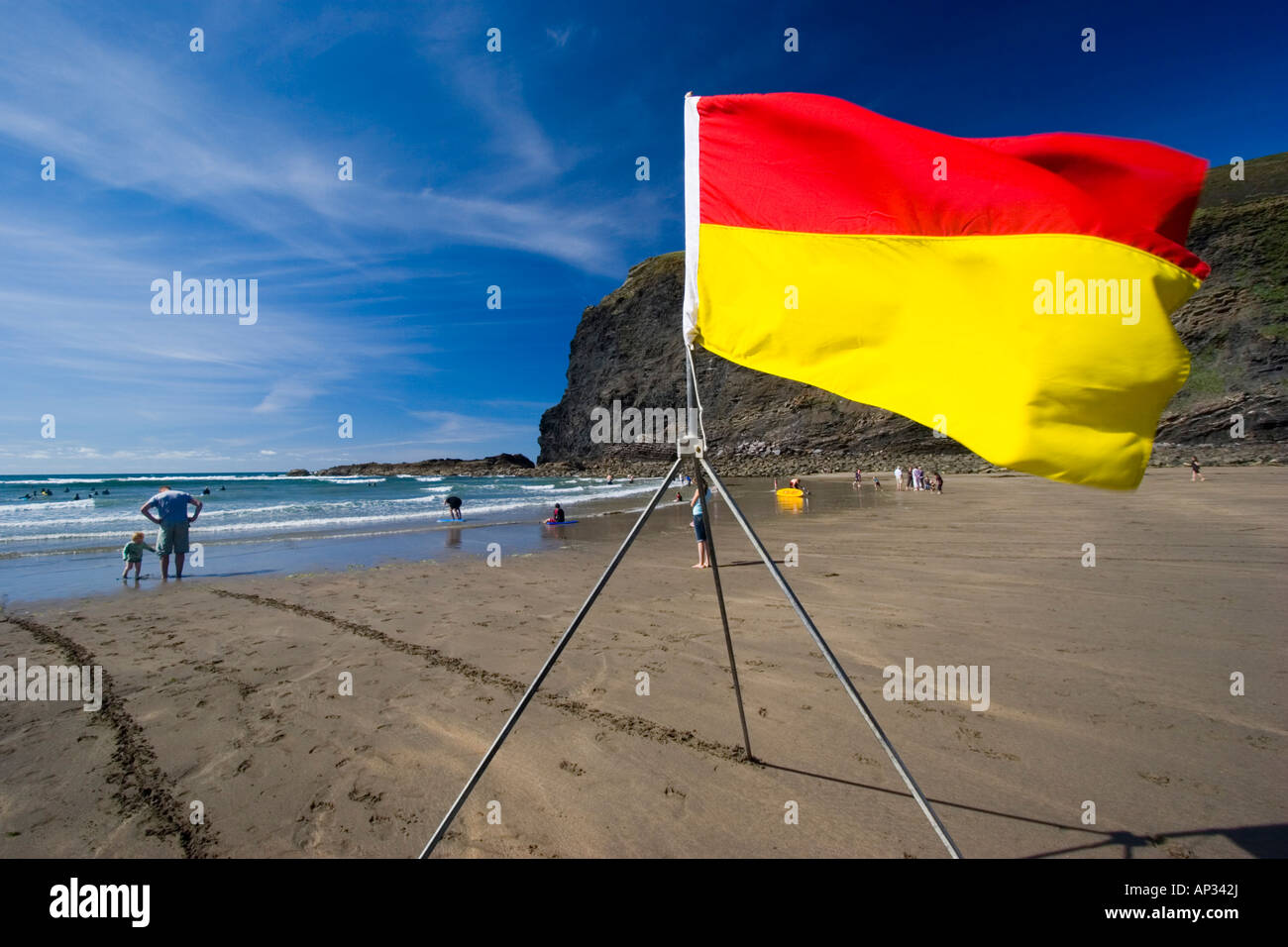Lifeguard s safety flag blowing in the wind on the beach at Crackington ...