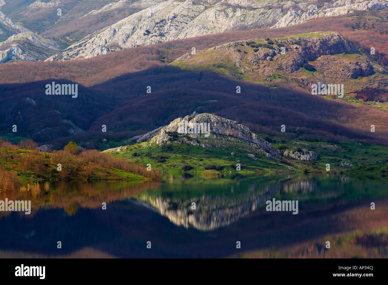 Landscape of a reservoir with reflection, Embalse de Porma, snow ...