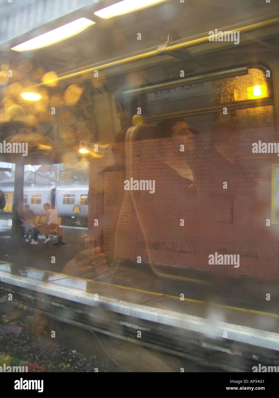 station platform seen from train window in rain Stock Photo - Alamy