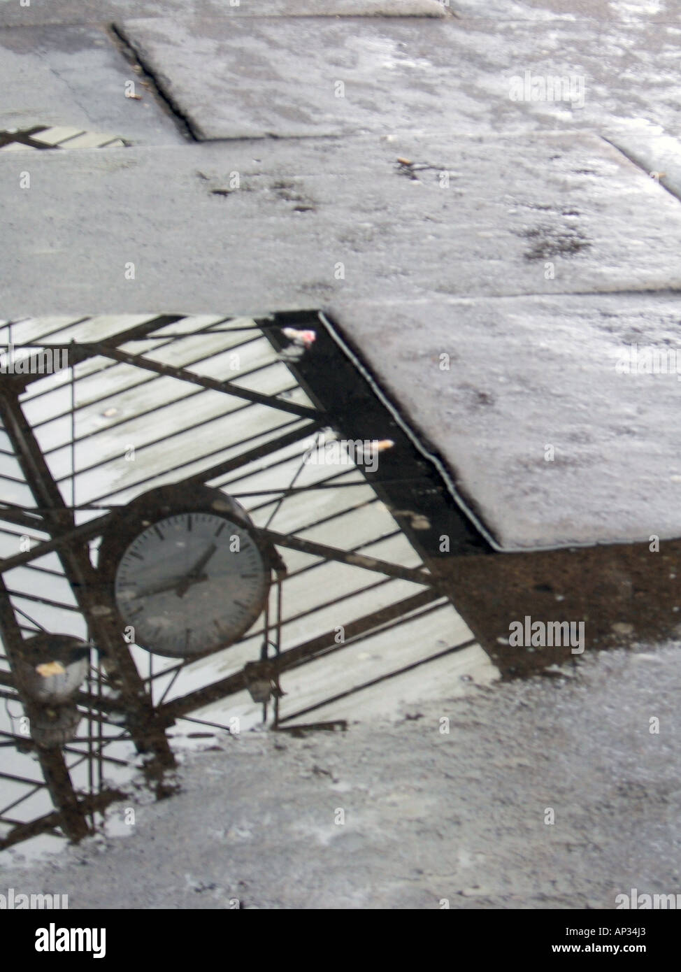 train platform clock in rain Stock Photo - Alamy