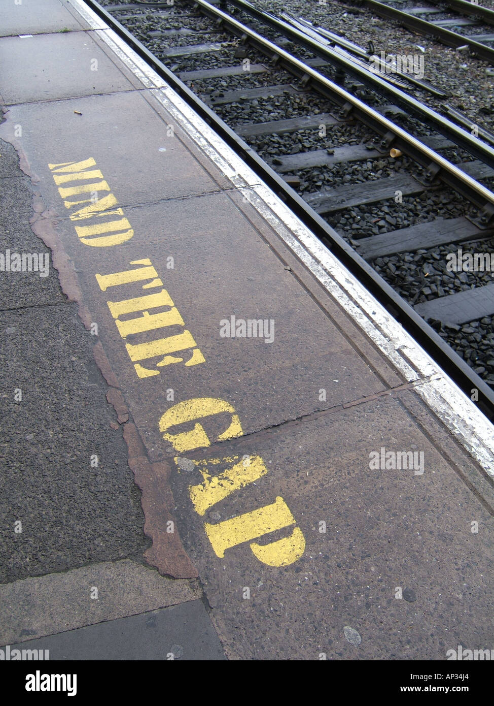 mind the gap words on station platform Stock Photo - Alamy