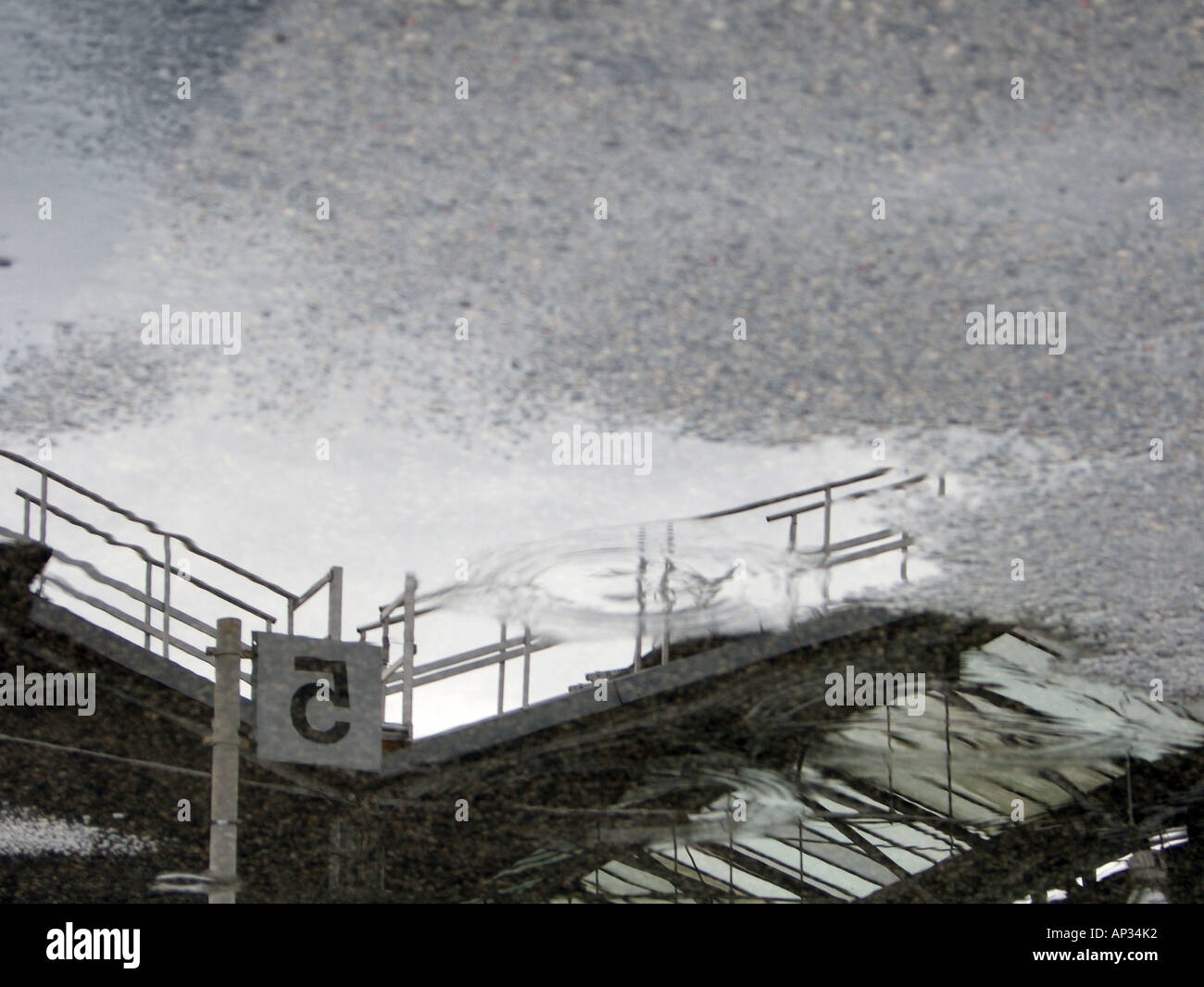 train platform number five in rain Stock Photo - Alamy