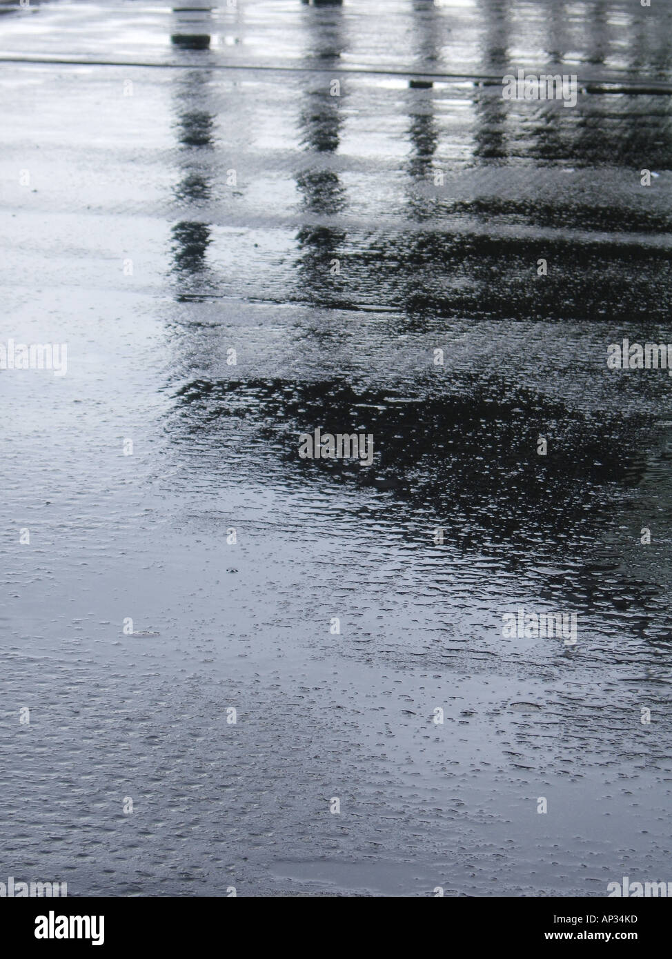 abstract reflection on wet rain pavement sidewalk street road Stock ...