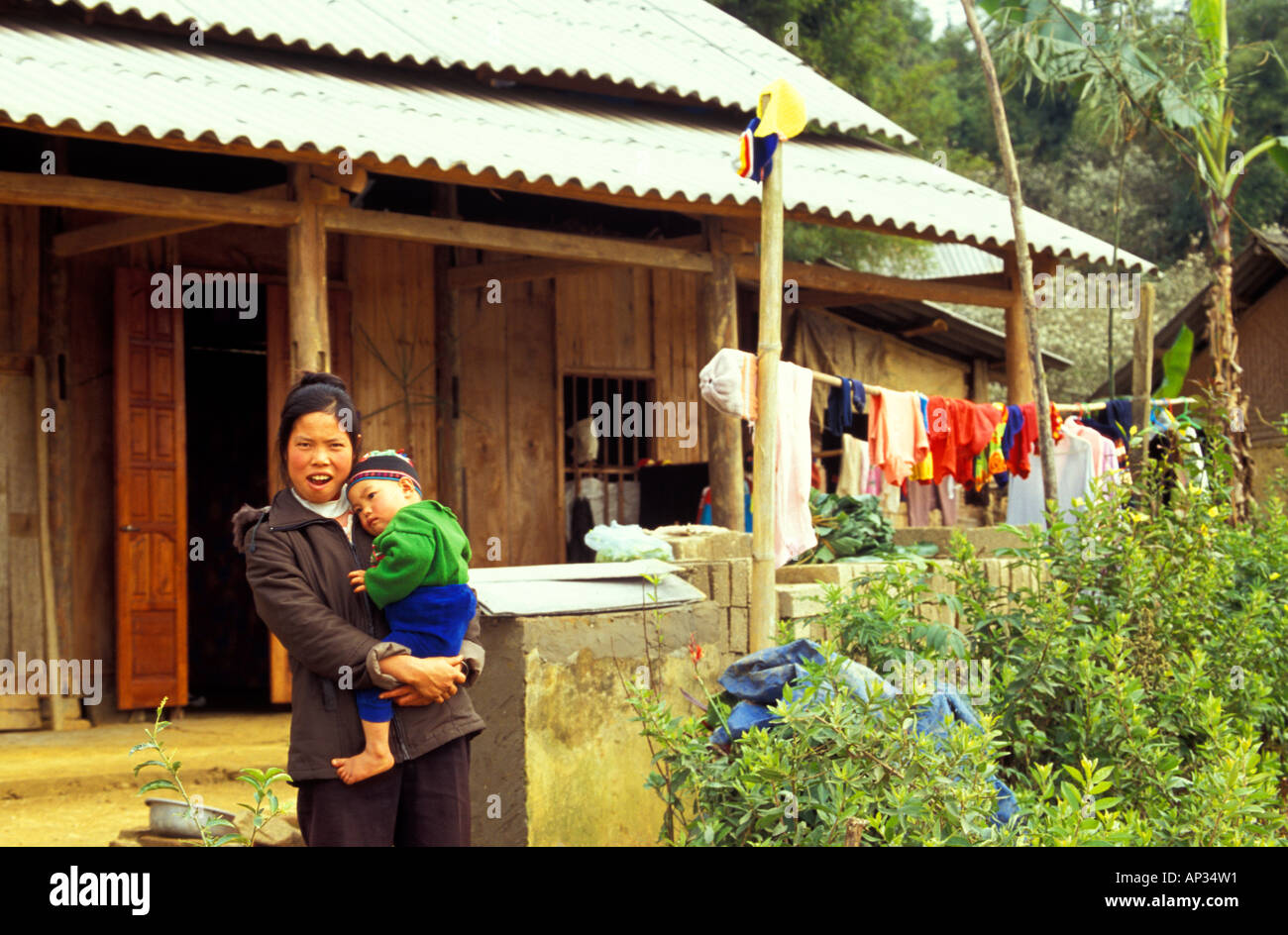 Vietnamese mother and child outside their home in Bac Ha village, north ...