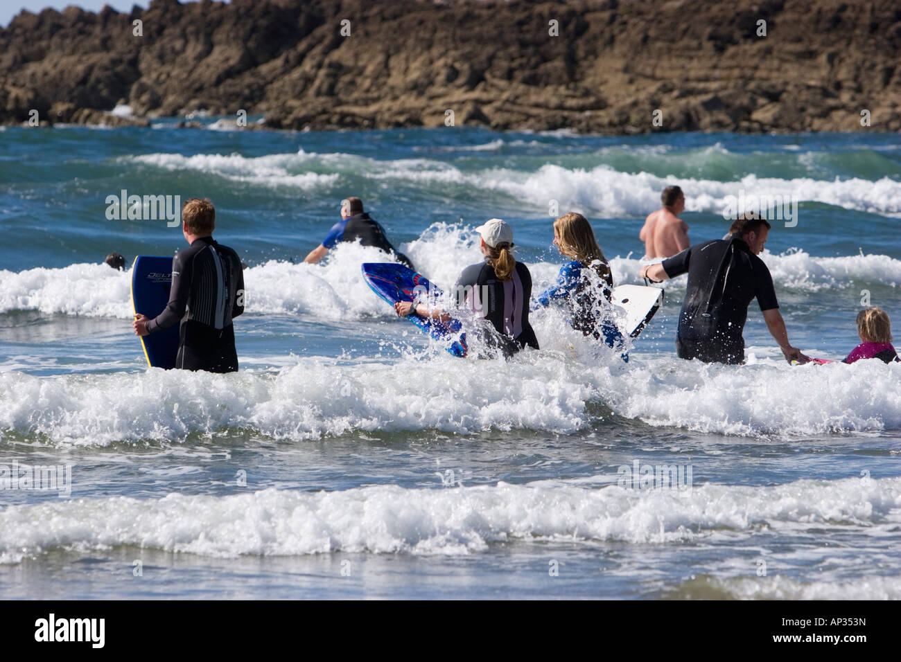 Surfers on a crowded beach Crackington Haven Stock Photo - Alamy