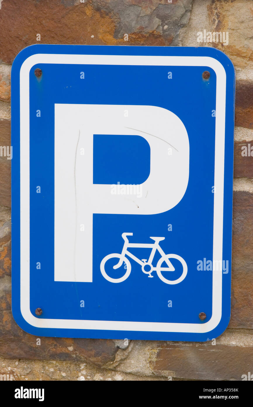 Blue bicycle parking sign Stock Photo - Alamy