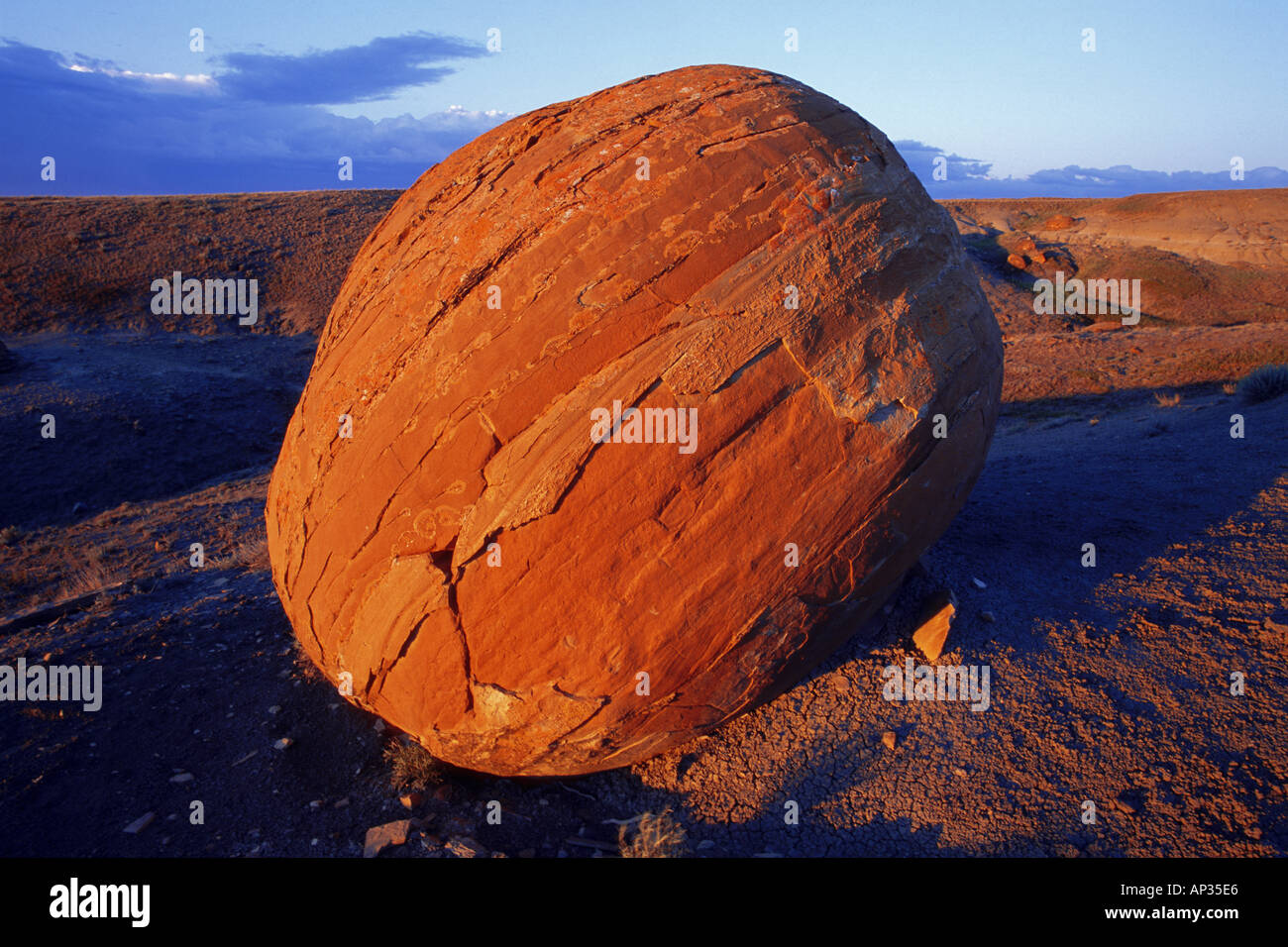 Large red boulder in desert valley, Red Rock Coulee, Alberta, Canada ...