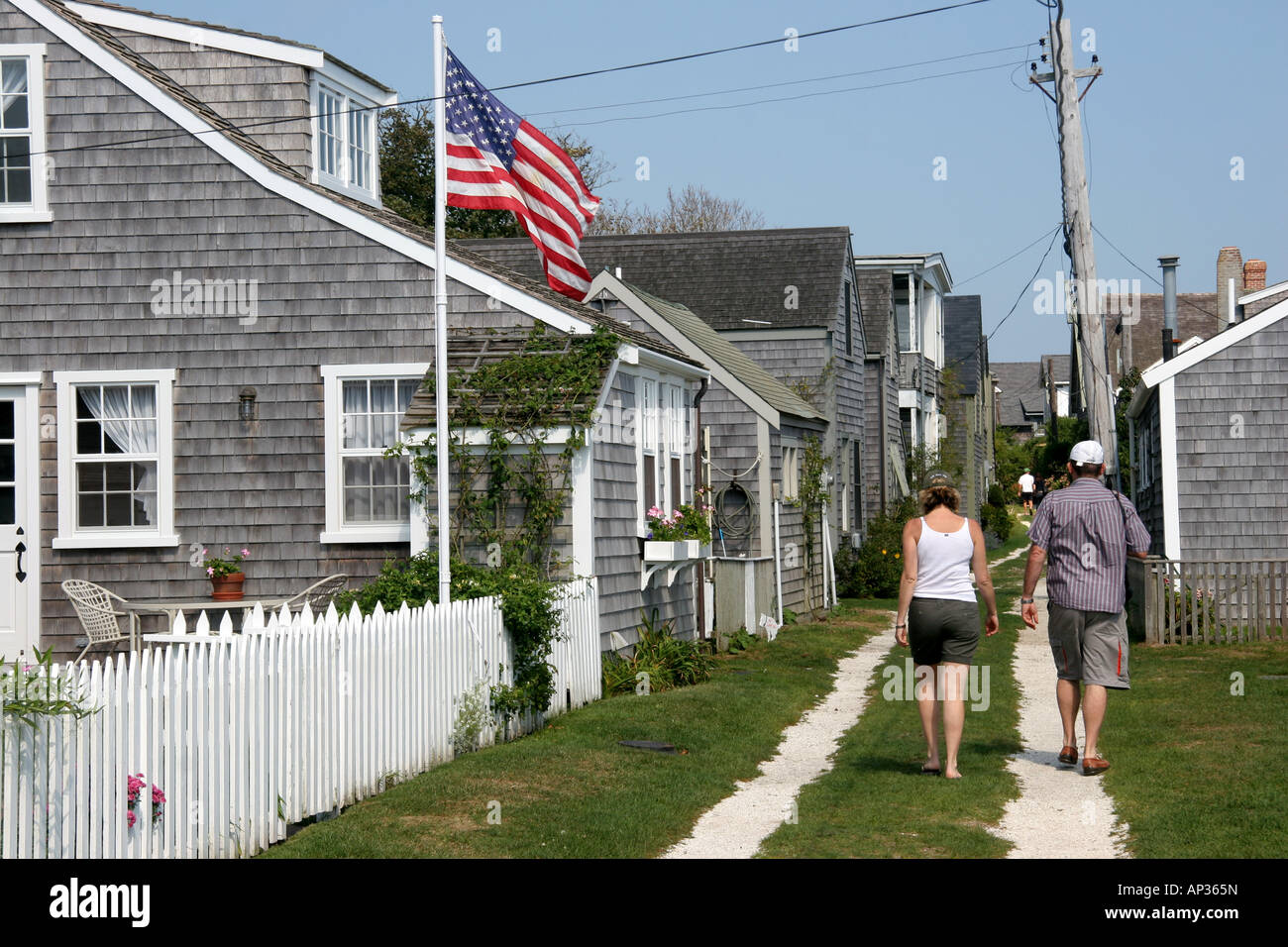 Couple walking on Front Street in Siasconset Nantucket Island Cape Cod ...