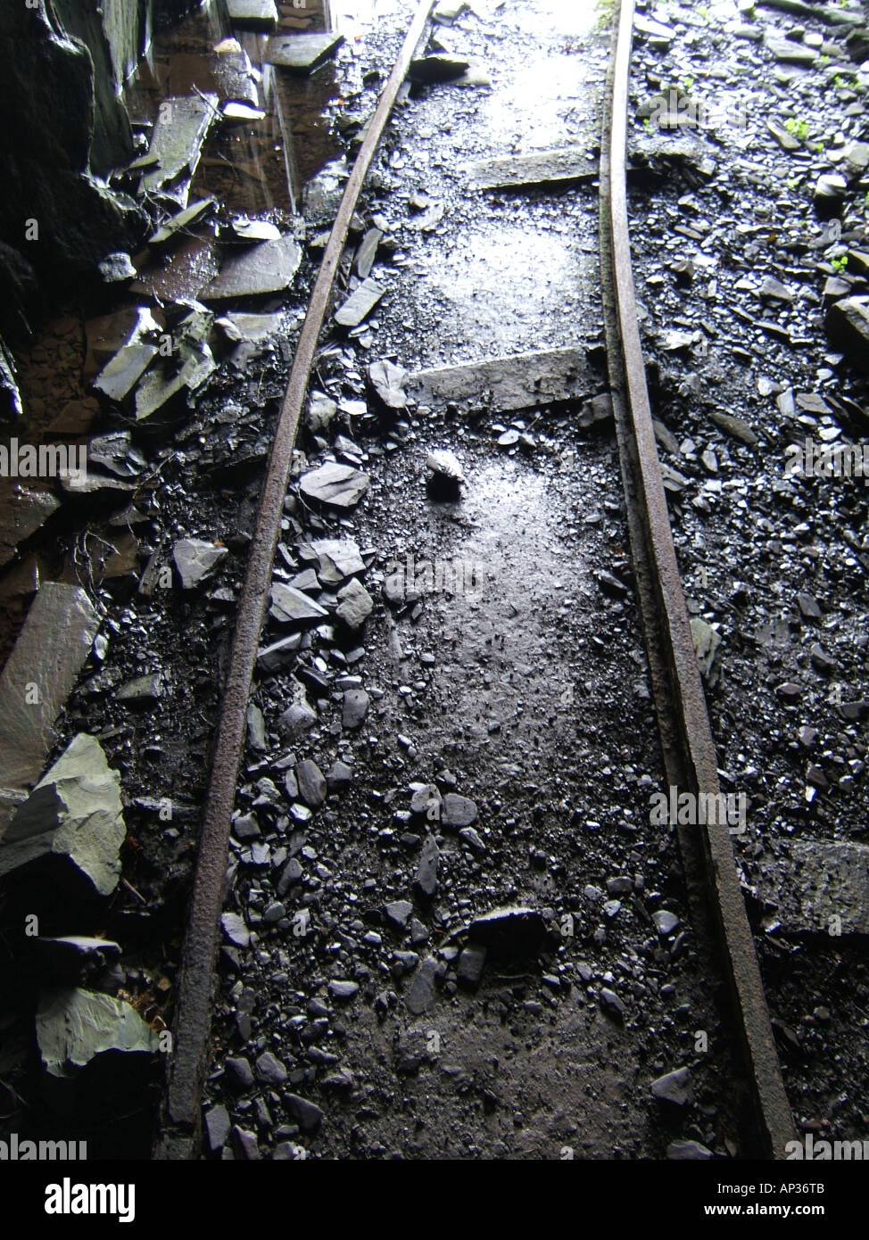 one single train track in dark tunnel Stock Photo - Alamy