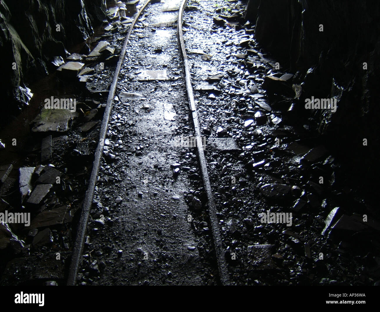 one single train track in dark tunnel Stock Photo - Alamy