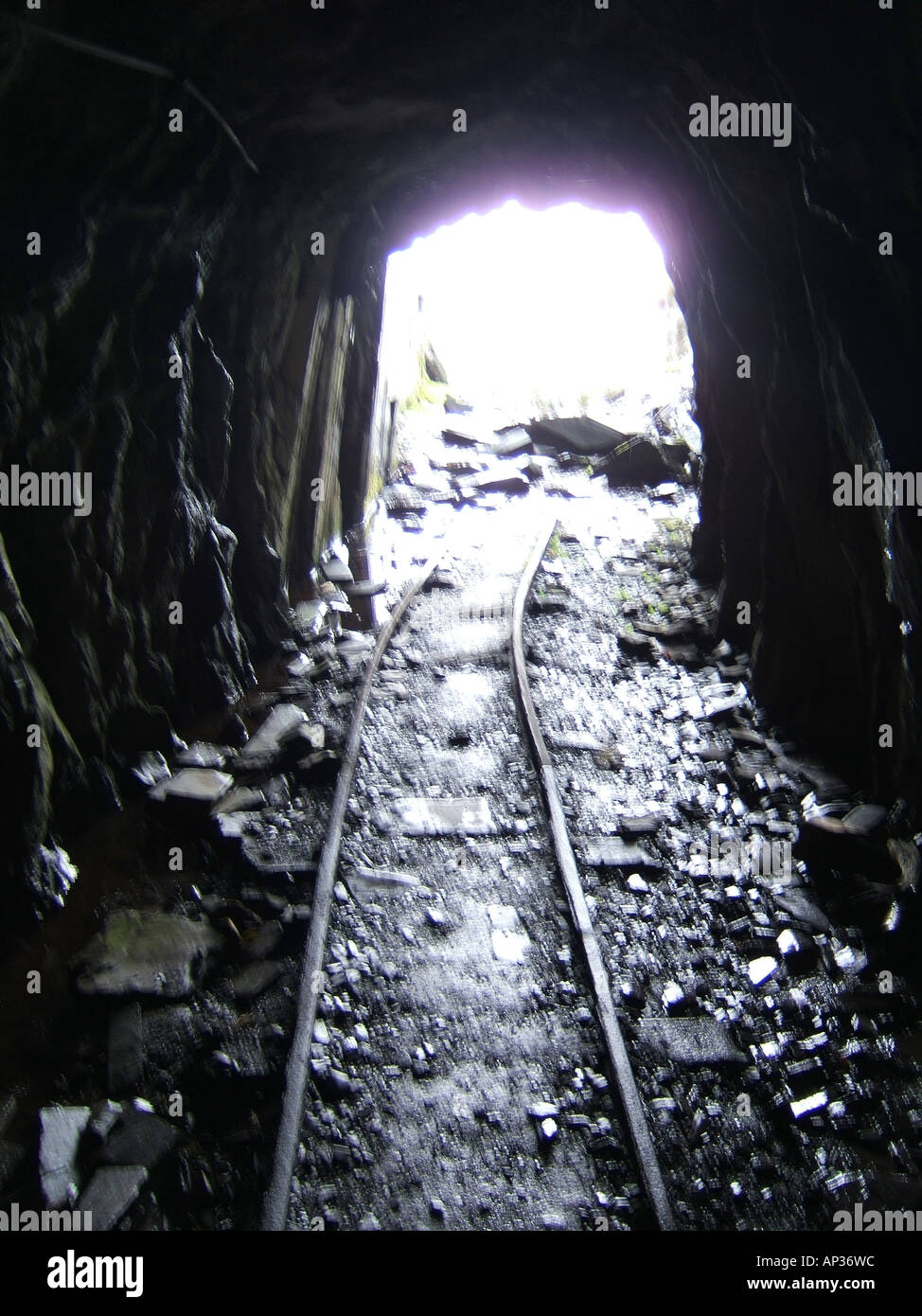 one single train track in dark tunnel Stock Photo - Alamy