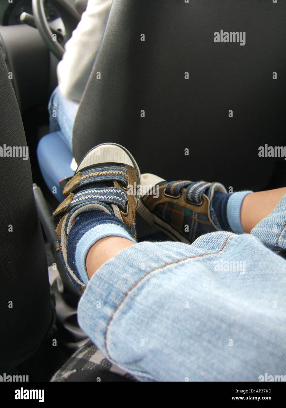 Boy legs back seat car hi-res stock photography and images - Alamy