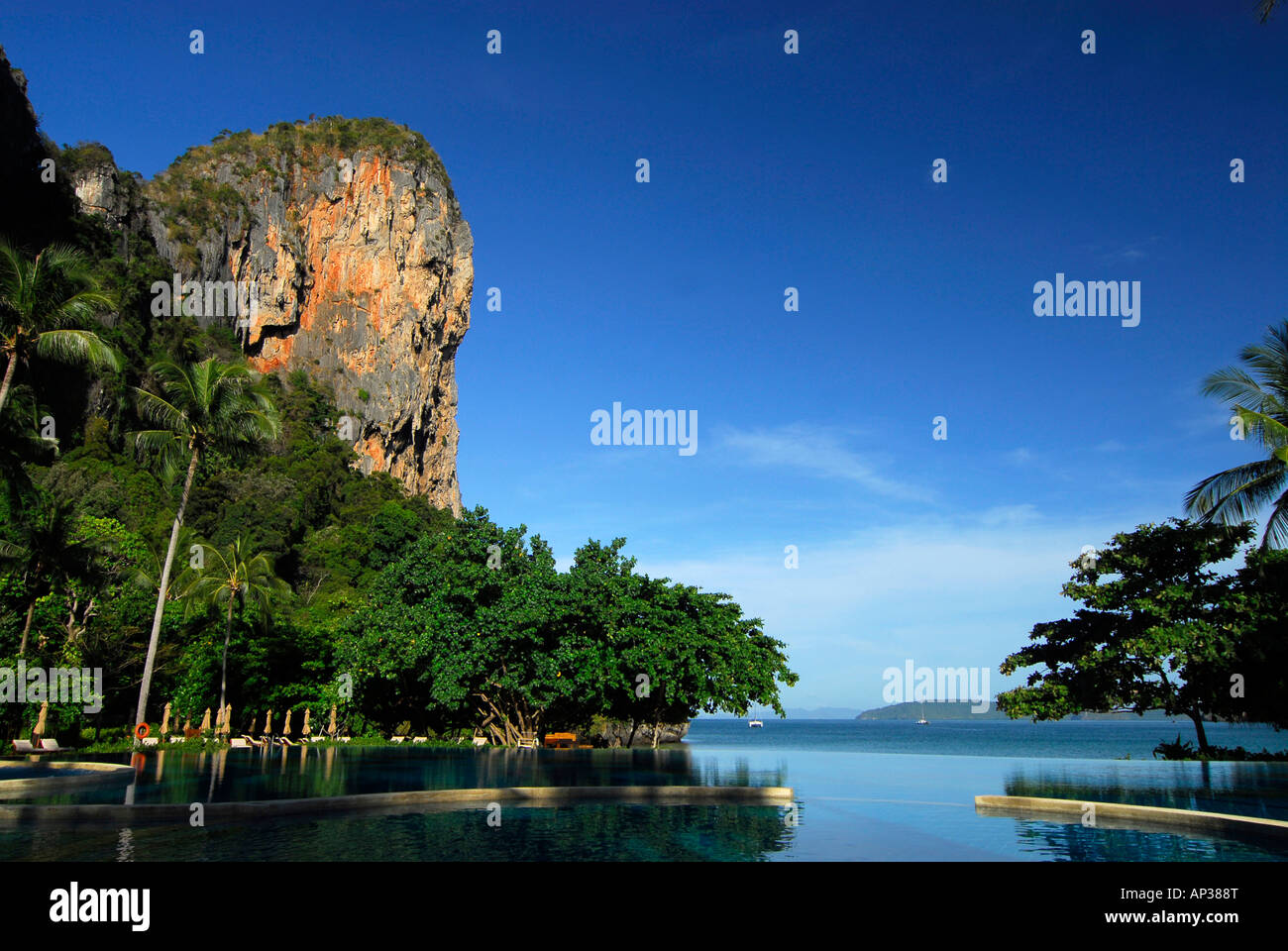 Pool in tropical garden of Hotel Rayavadee with limestone cliffs, Hat ...