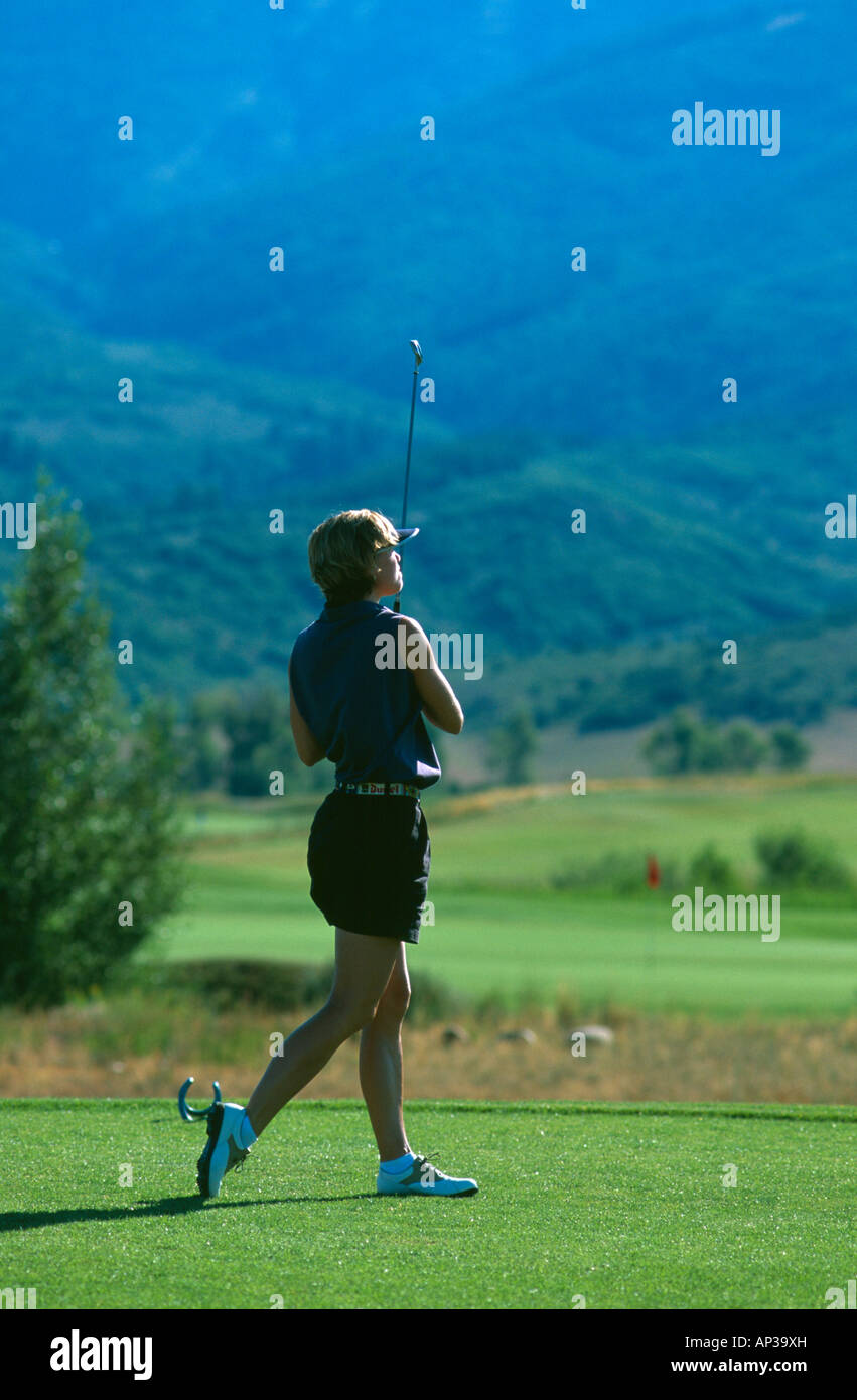 Golfer teeing off Haymaker golf course Steamboat Springs Colorado USA ...