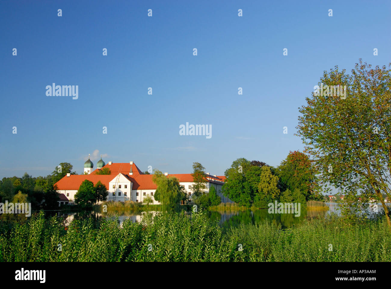 Monastery of Seeon in lake Seeoner See, Chiemgau, Upper Bavaria ...
