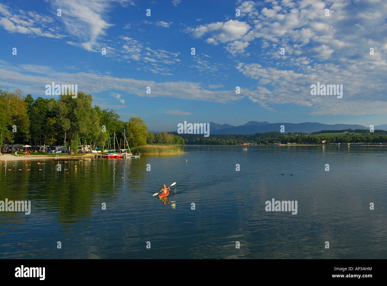 lake Waginger See with kayaker and sailing boats at campground ...