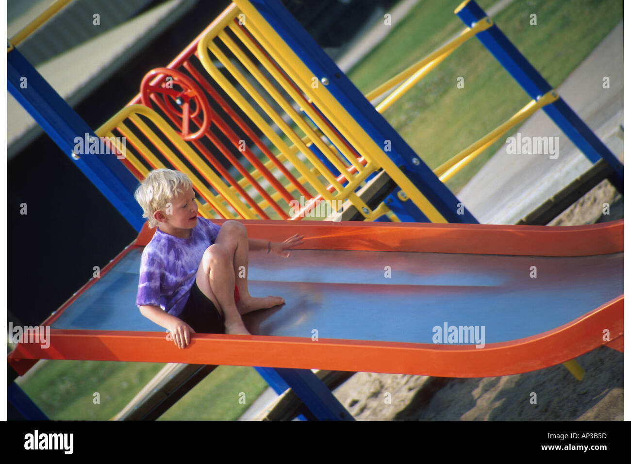 Boy and slide Stock Photo - Alamy