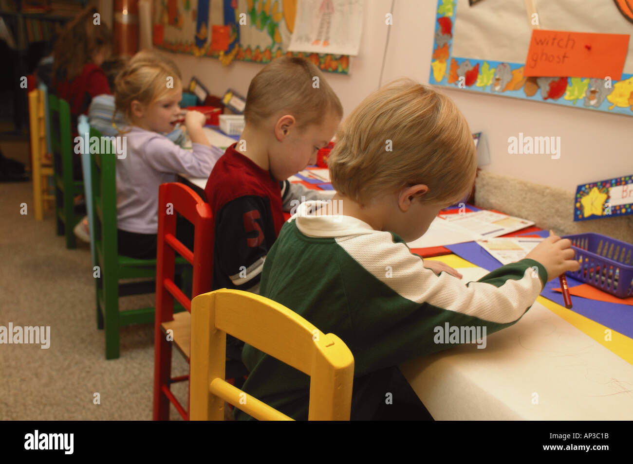 Children intent on completing their projects Stock Photo - Alamy