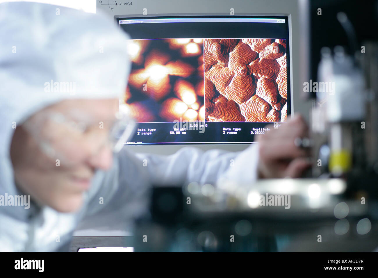 A woman, graduand, working on an Atomic force microscope, Organic ...