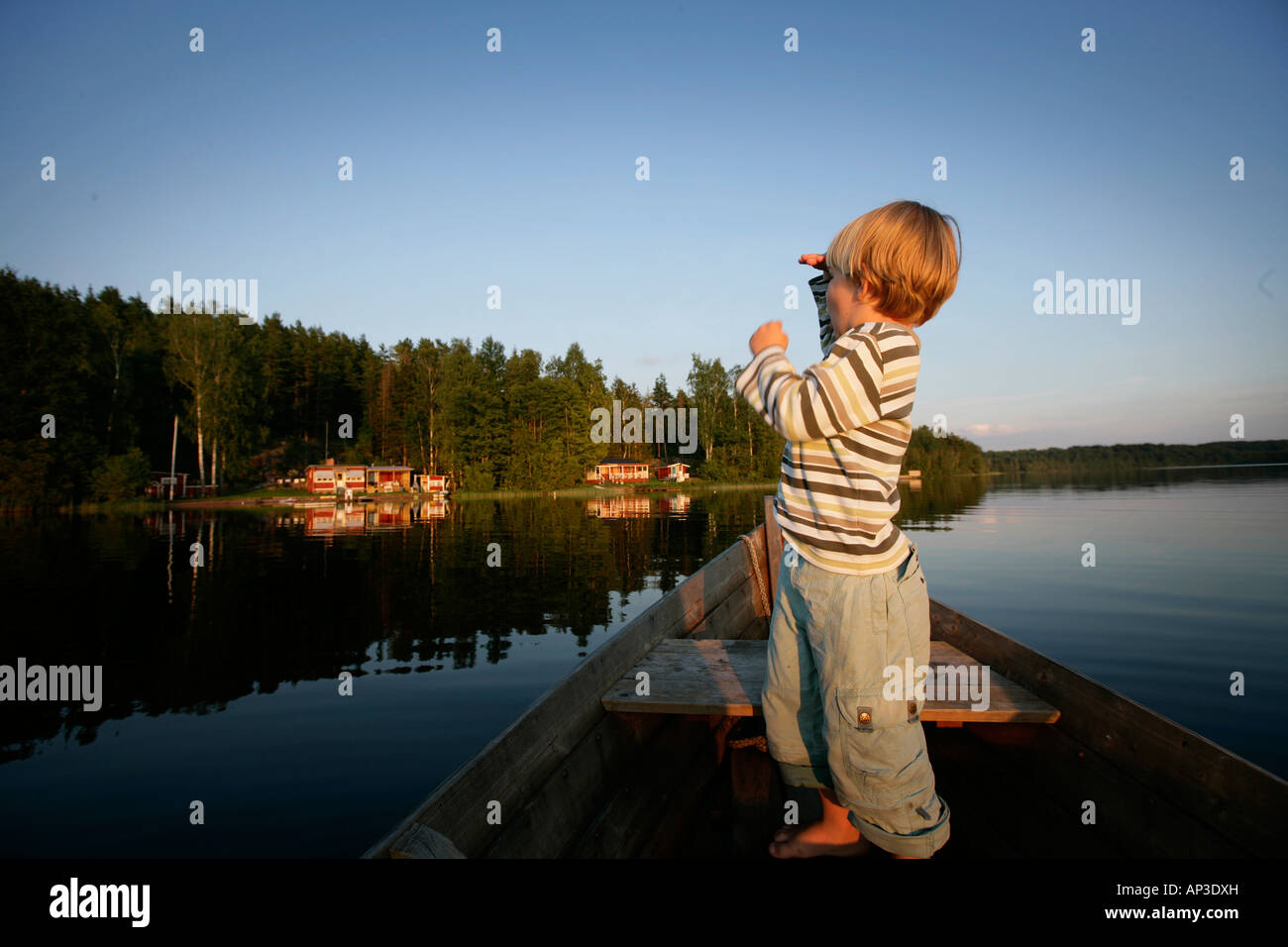 Boy rowing boat hi-res stock photography and images - Alamy