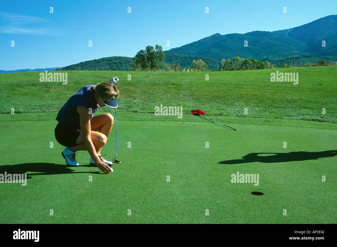 Golfer putting Haymaker golf course Steamboat Springs Colorado USA ...