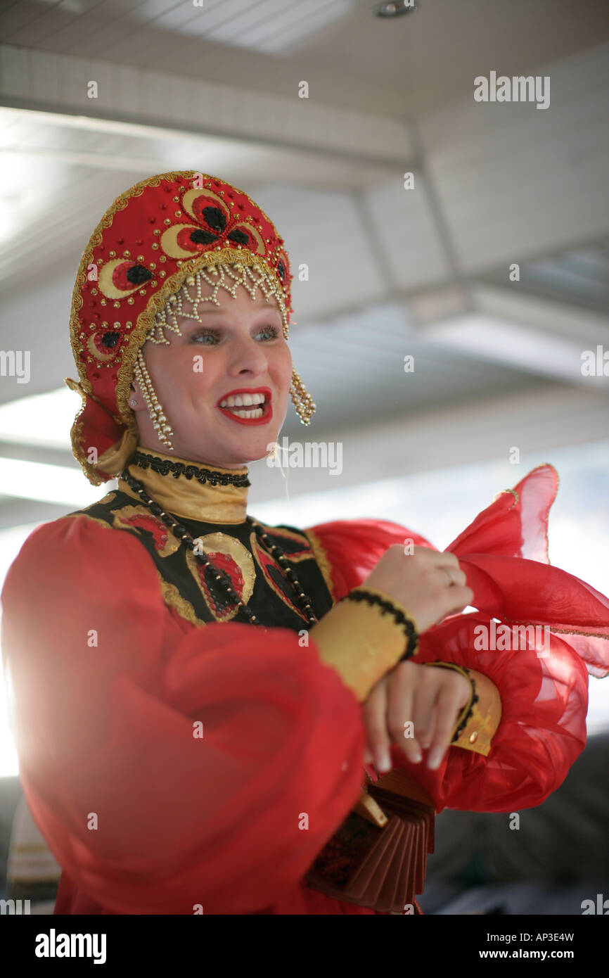 Singer in traditional Russian costume, tour boat on Newa river, St ...
