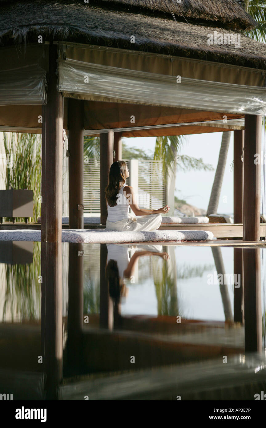 Woman meditating by a pool, Reflection, Relaxation, Wellness, Holiday ...