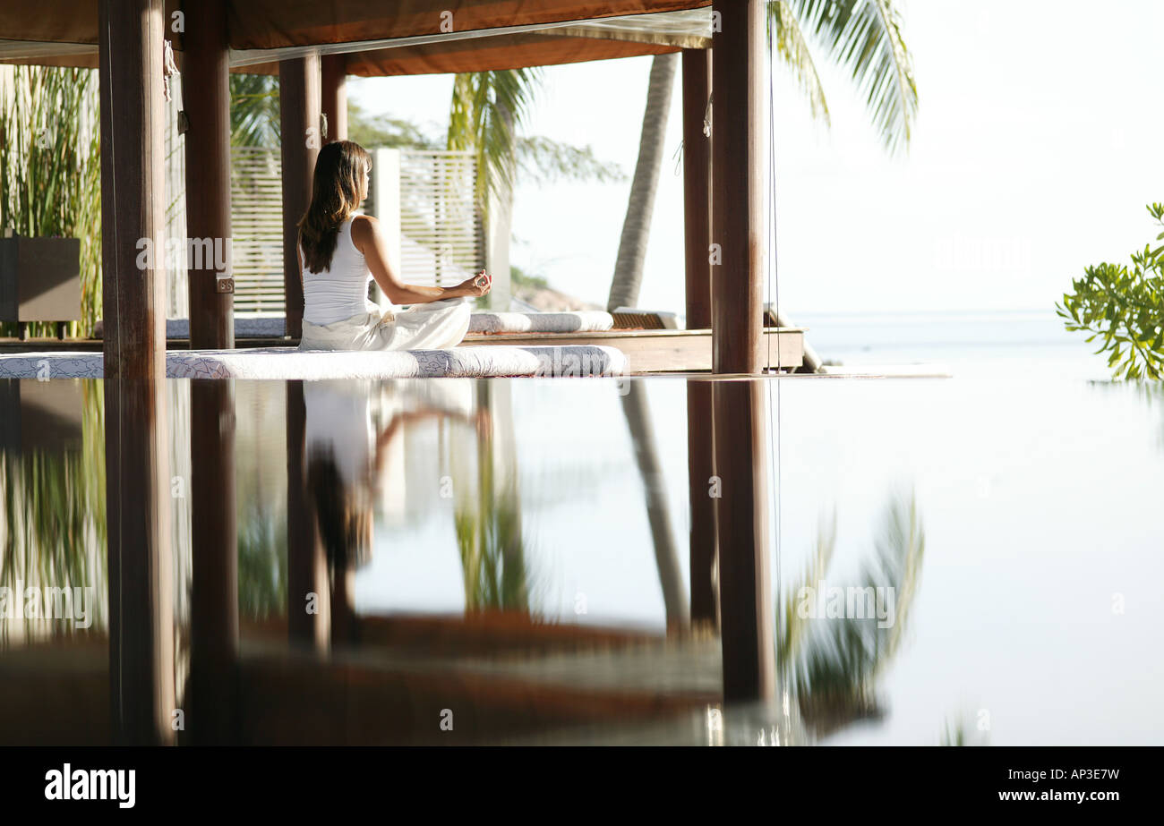 Woman meditating by a pool, Reflection, Relaxation, Health, Wellness ...
