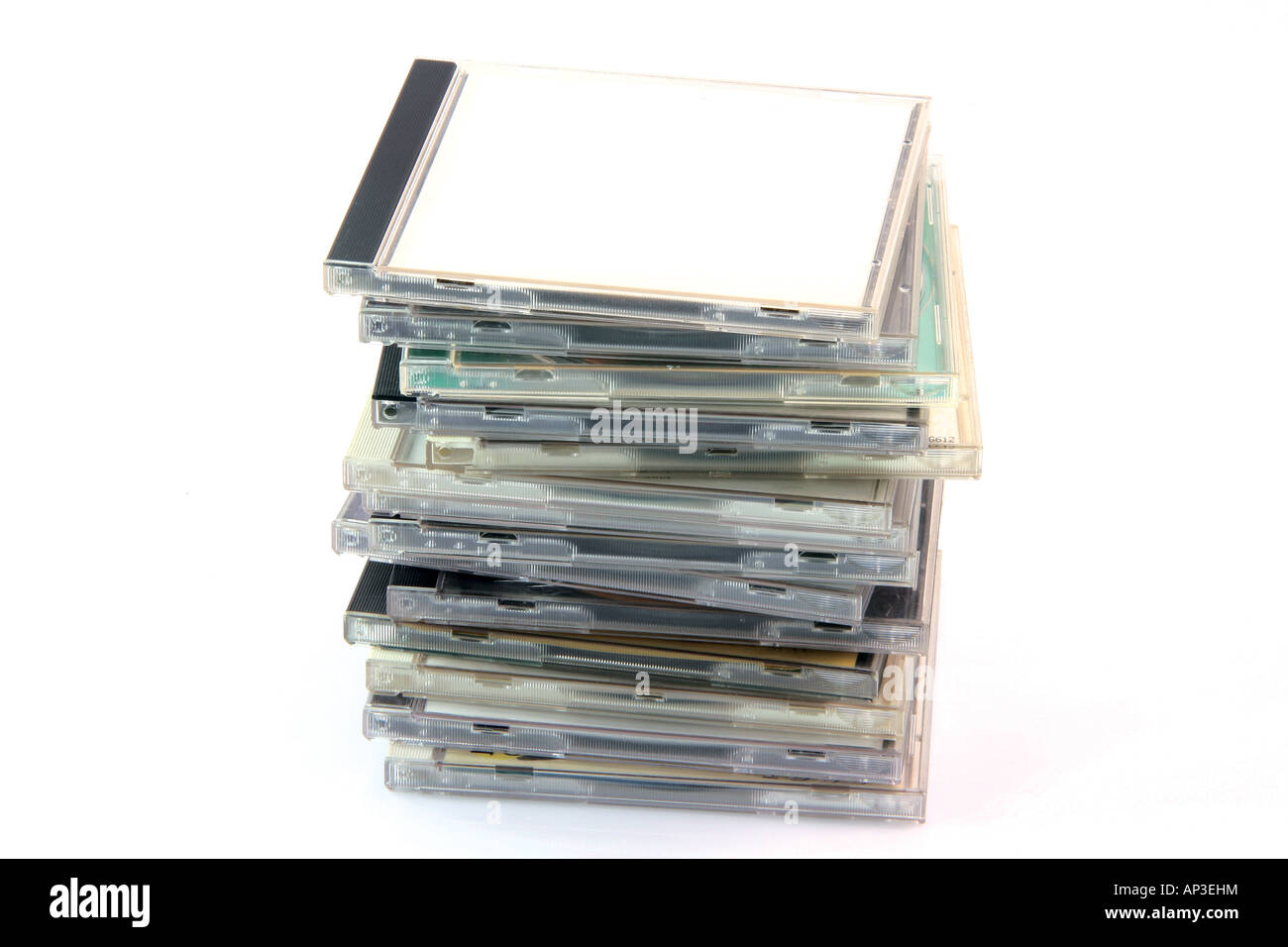 pile of cd cases isolated on white background and empty label to add ...