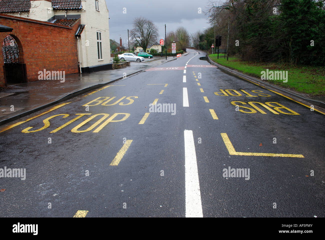 Bus Stop Sign on Road Stock Photo - Alamy