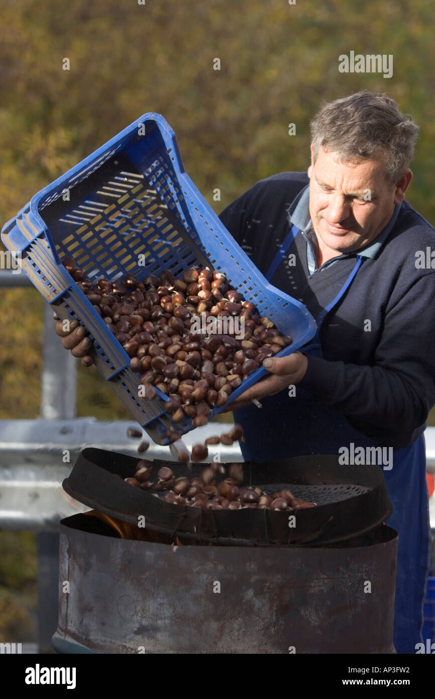 Market seller roasting chestnuts hi-res stock photography and images ...