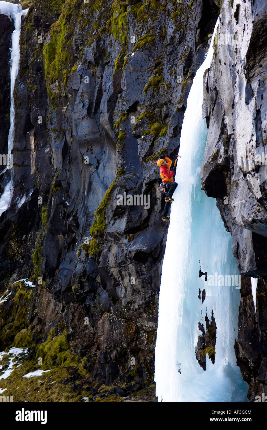 Ice climber on frozen waterfall, Iceland Stock Photo - Alamy