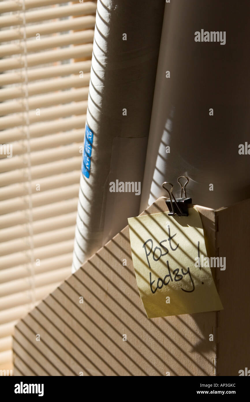 Post Today! message on box of parcel tubes Stock Photo - Alamy