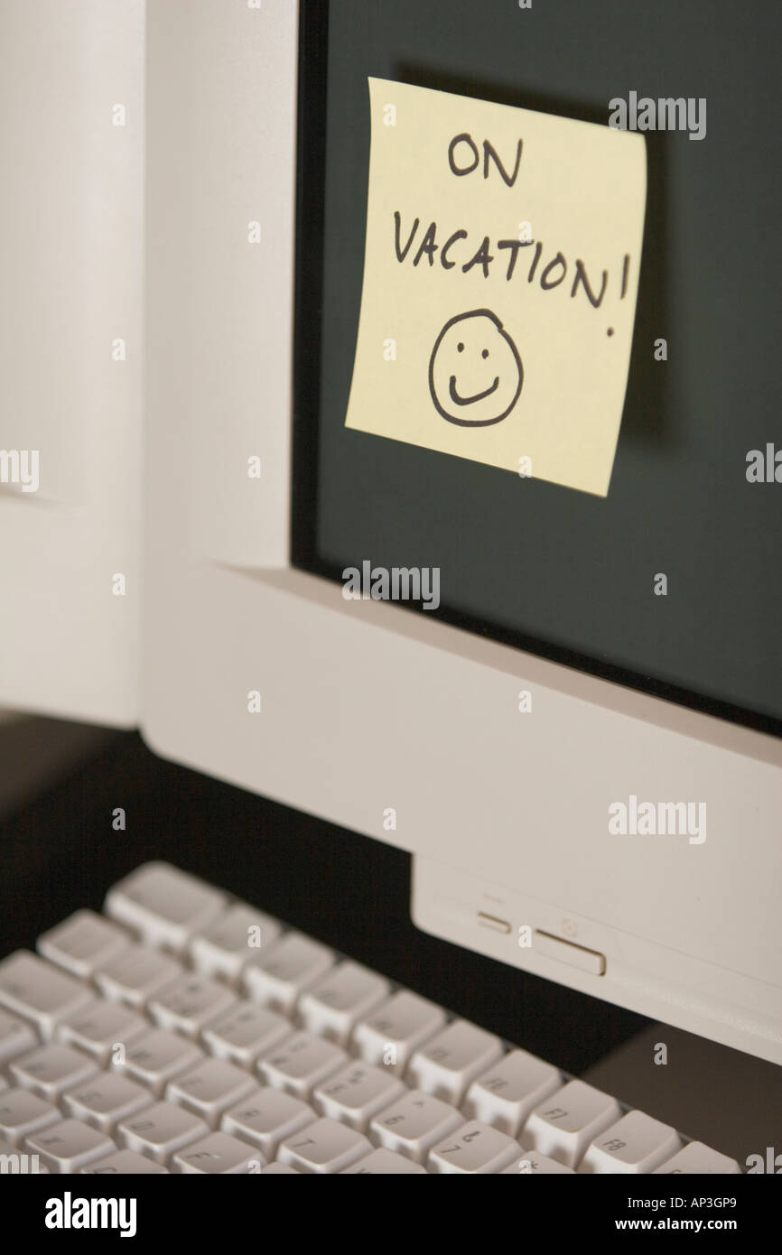 On vacation sticker on computer screen workstation Stock Photo - Alamy