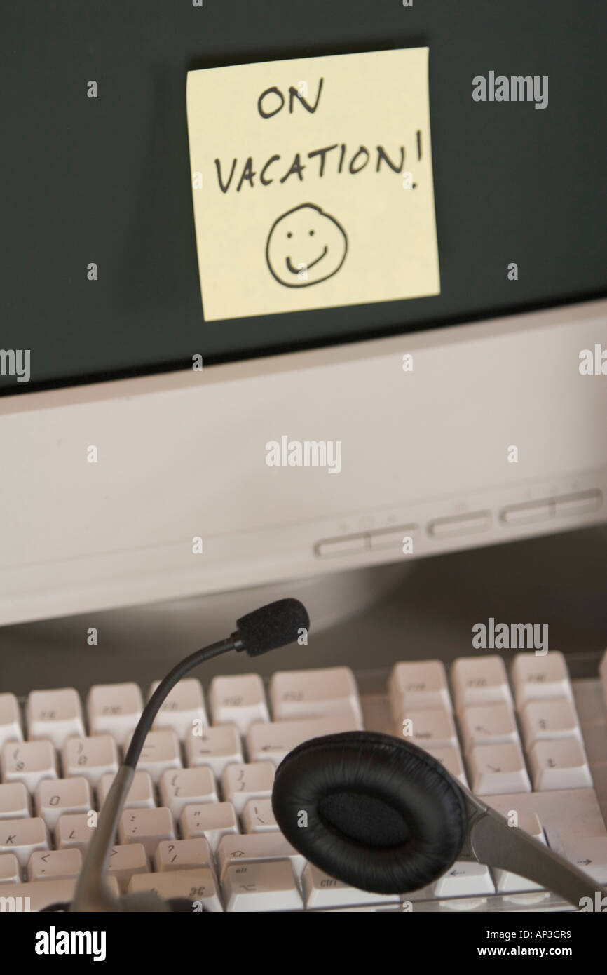 On vacation sticker stuck to computer screen Stock Photo - Alamy
