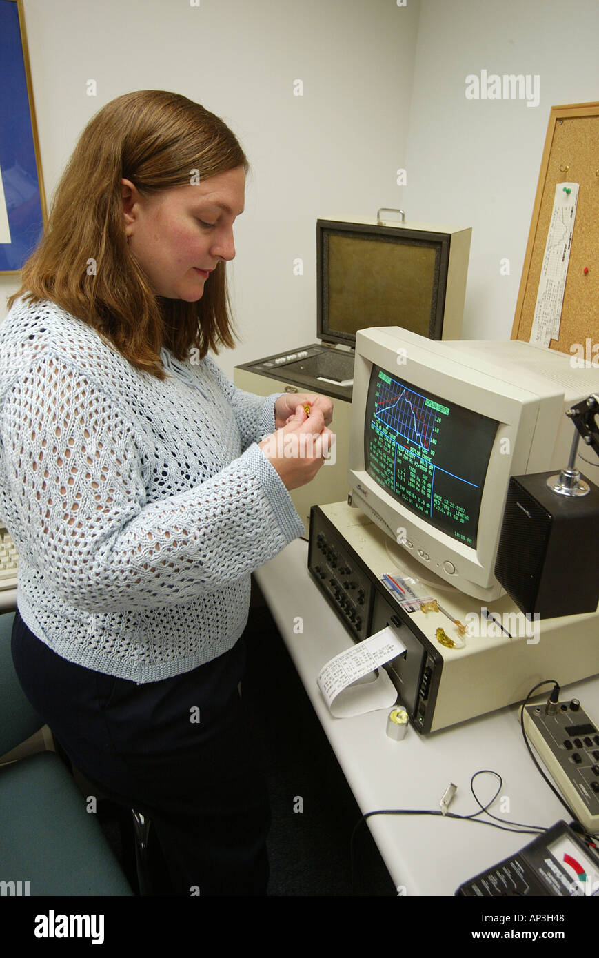 Audiologist checks hearing aid performance using a special software ...