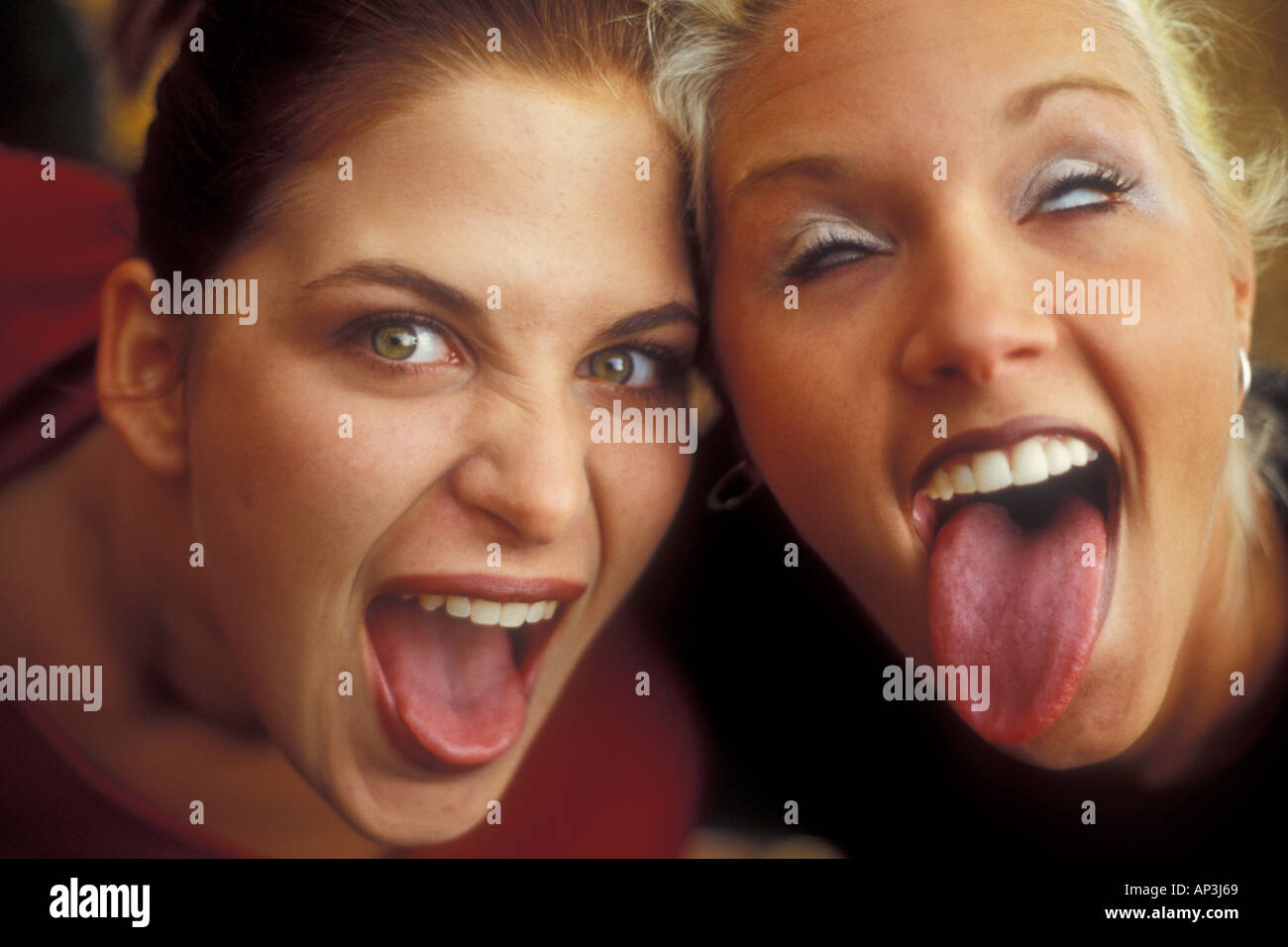 Friends sticking out tongues hi-res stock photography and images - Alamy