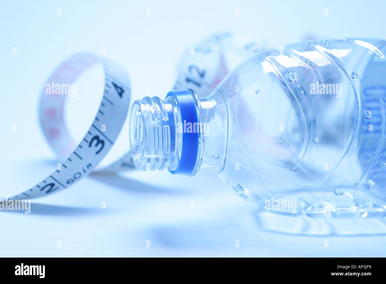Water Bottle and Tape Measure Stock Photo - Alamy