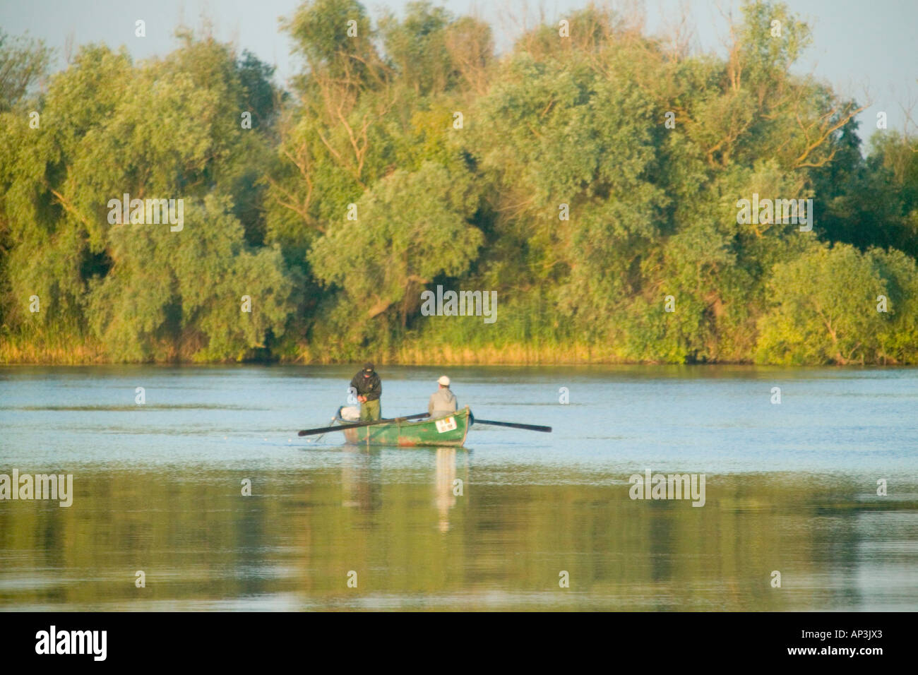 Romania, Danube Delta, men fishing in the river Stock Photo - Alamy
