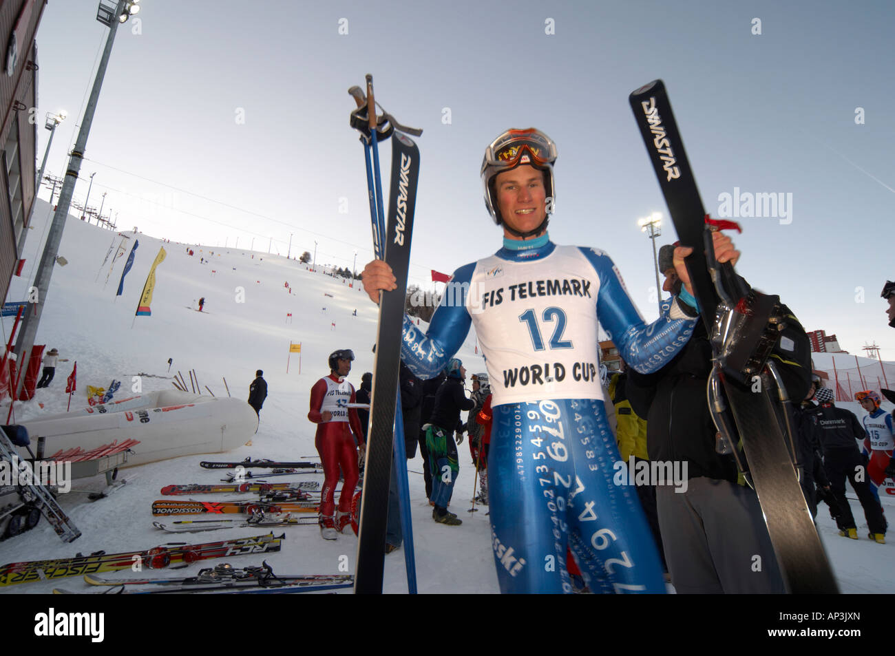 A competitor takes off his skis at the 2008 Telemark World Cup at ...
