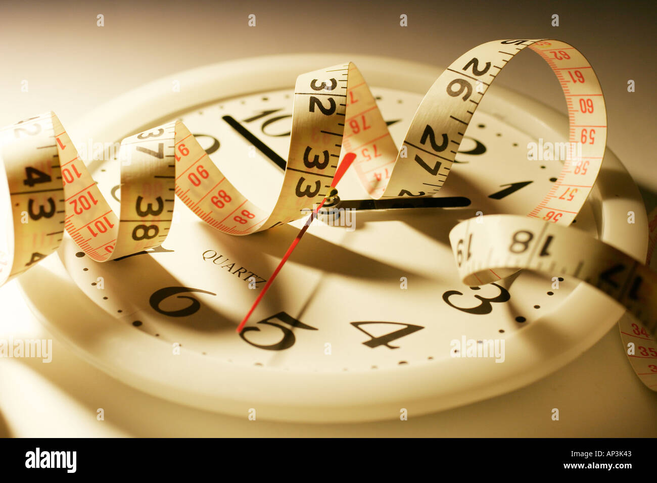 Clock and Tape Measure Stock Photo - Alamy