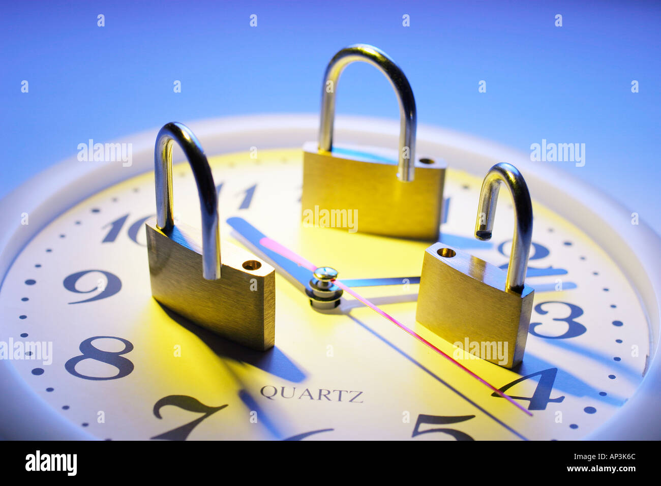 Padlocks on Clock Stock Photo - Alamy
