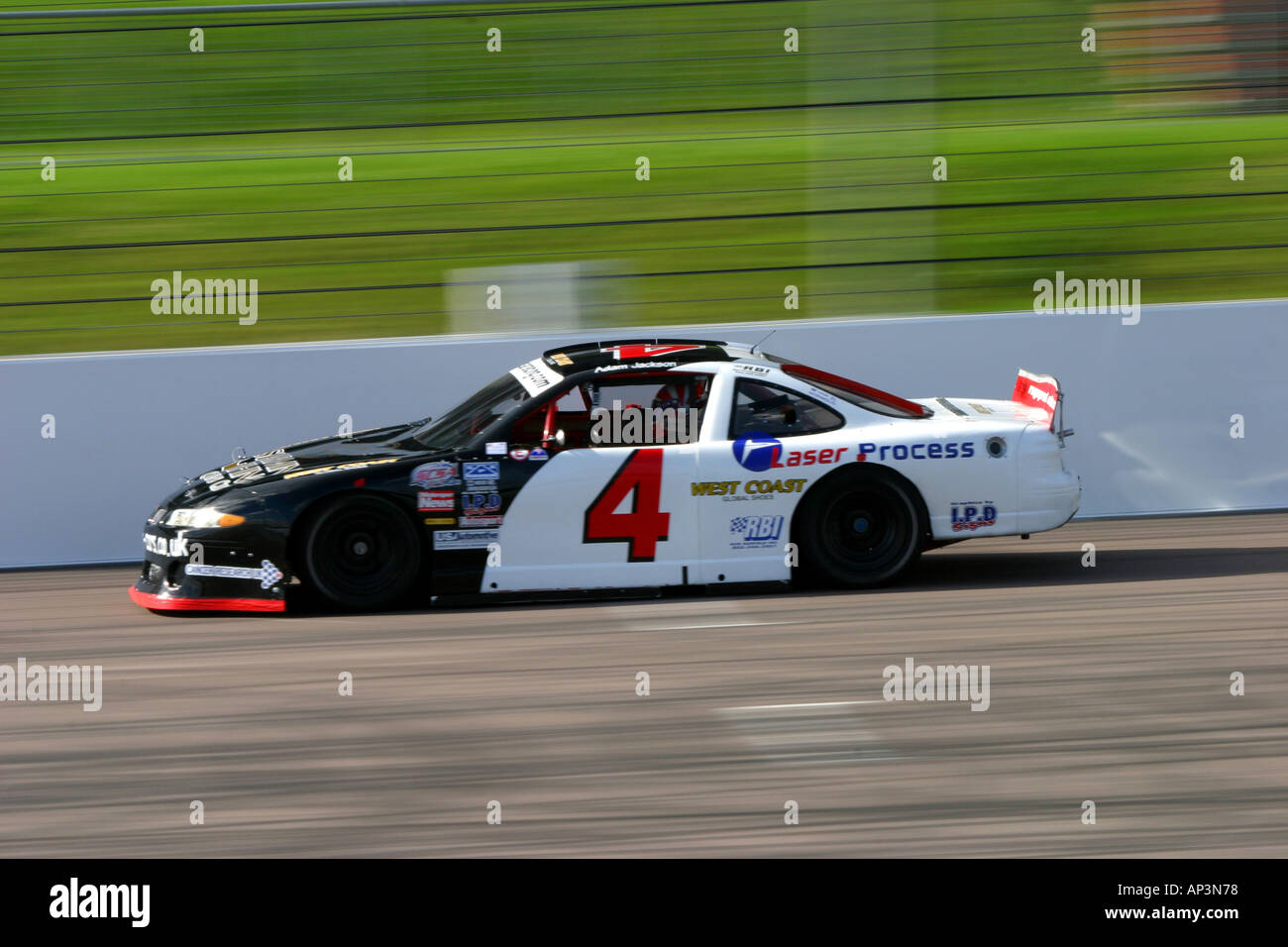 V8 Nascar type stock cars racing on a banked oval circuit Stock Photo ...