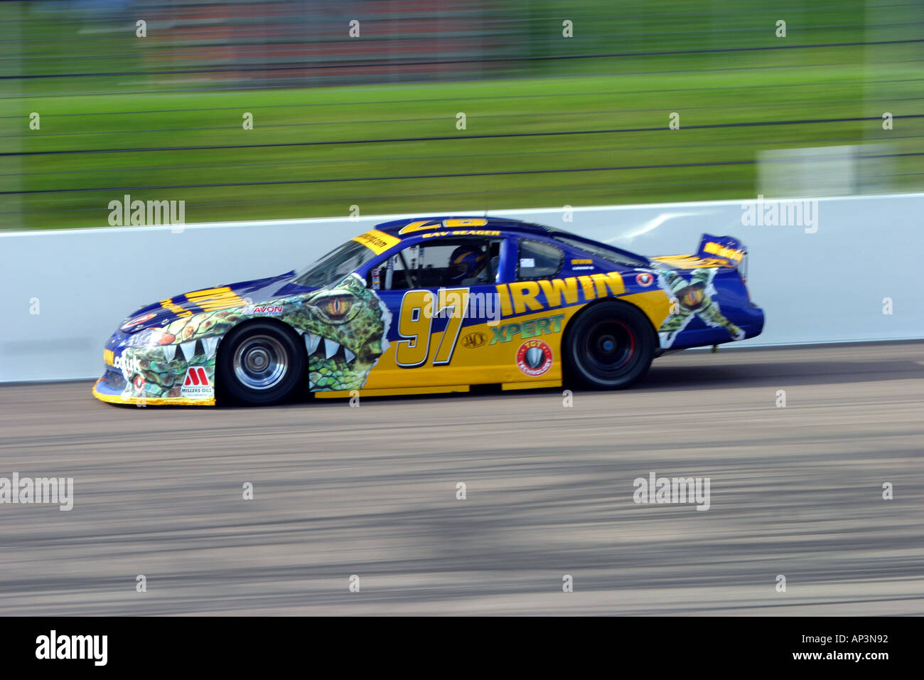 V8 Nascar type stock cars racing on a banked oval circuit Stock Photo ...