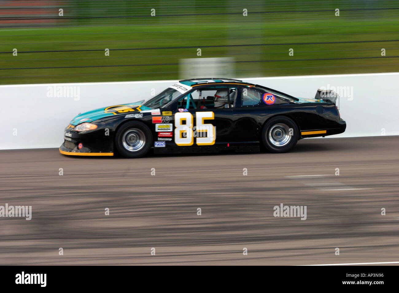 V8 Nascar type stock cars racing on a banked oval circuit Stock Photo ...