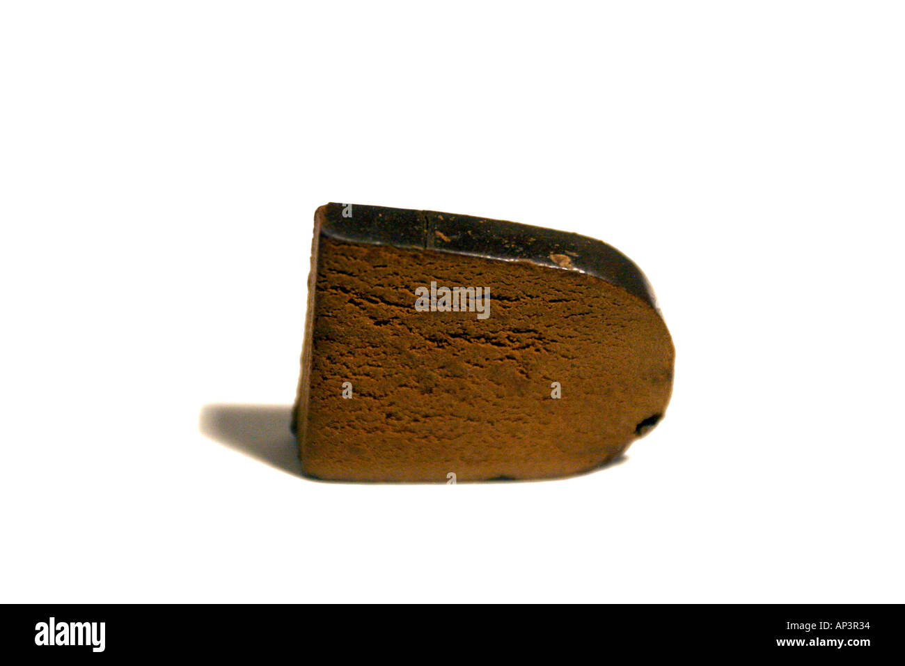 Hashish or cannabis resin a small lump of the illegal drug on a white ...