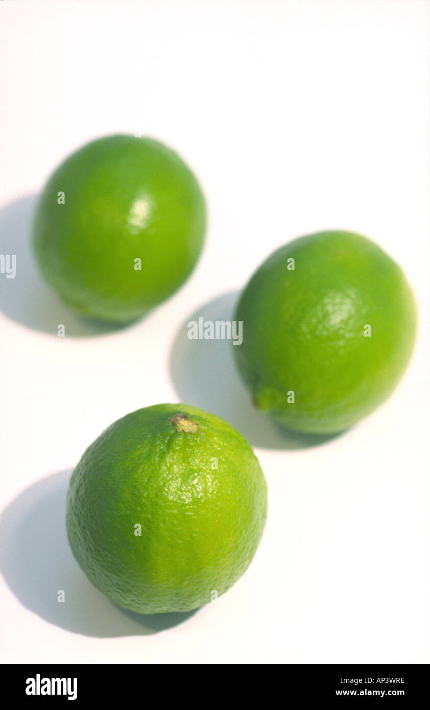 Three Limes on a White Background Stock Photo - Alamy