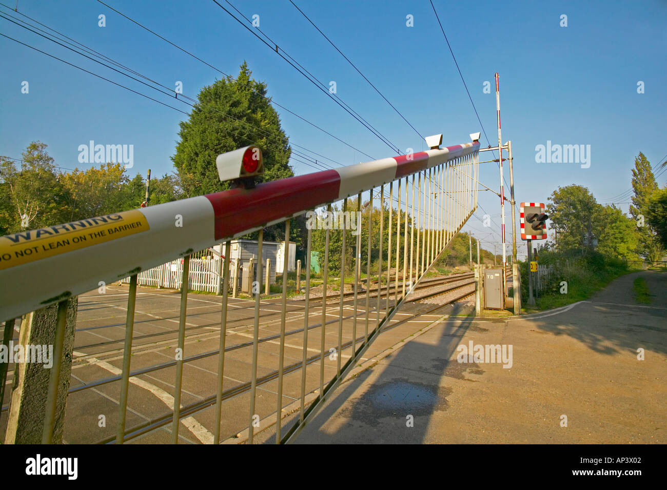 automatic barriers at a road rail crossing Stock Photo - Alamy