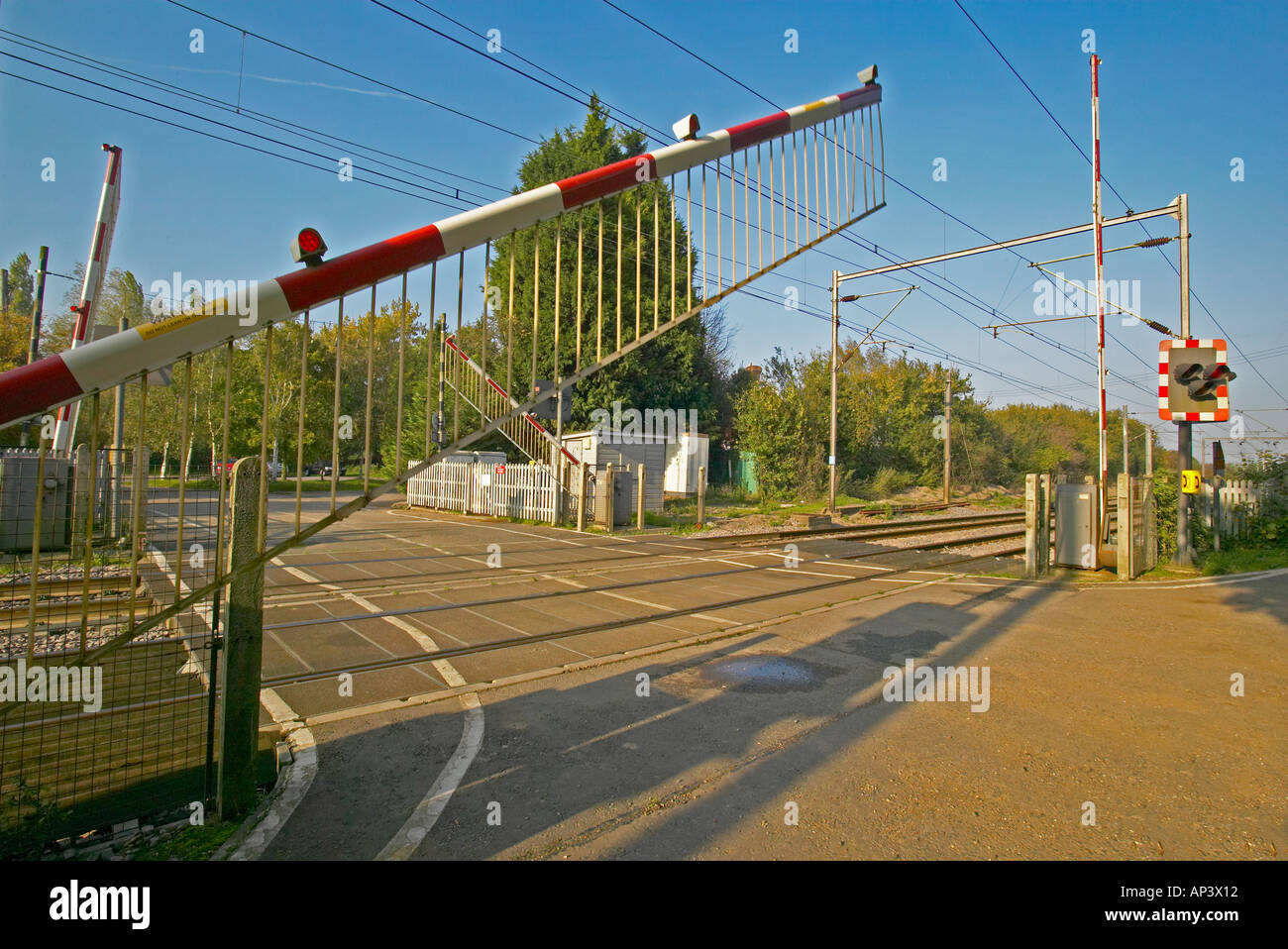 automatic barriers at a road rail crossing Stock Photo - Alamy
