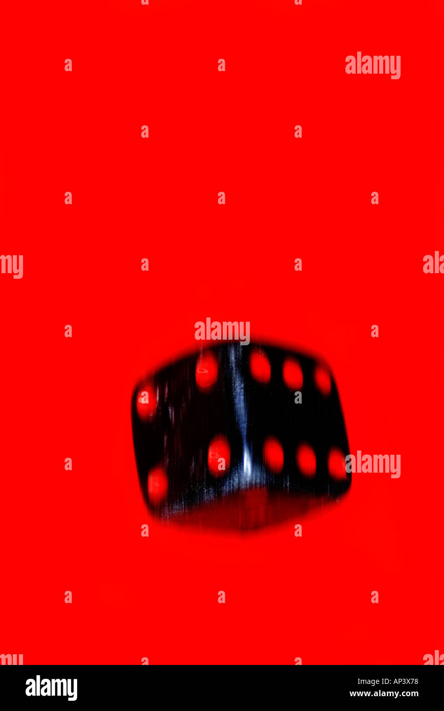 black die on red background Stock Photo - Alamy